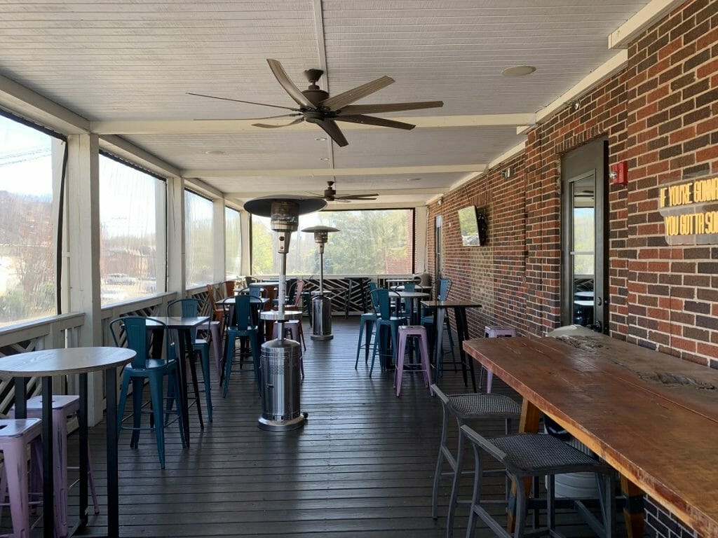 Before & After: Wildly Eclectic Hotel Porch Interior Design - Decorilla ...